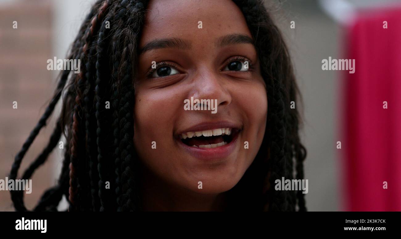 Happy Brazilian preteen girl smiling. Black African descent child ...