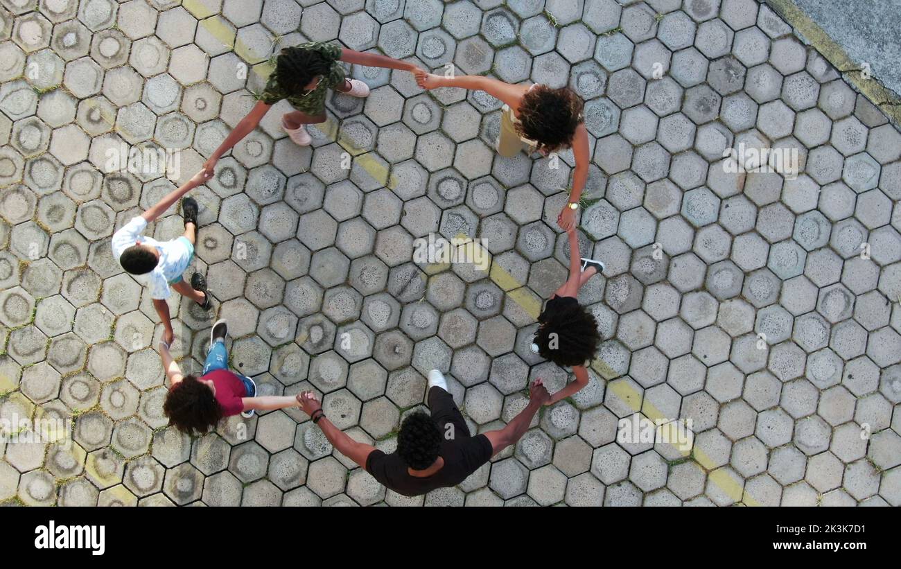 Happy family holding hands in circle joining hand and community support ...