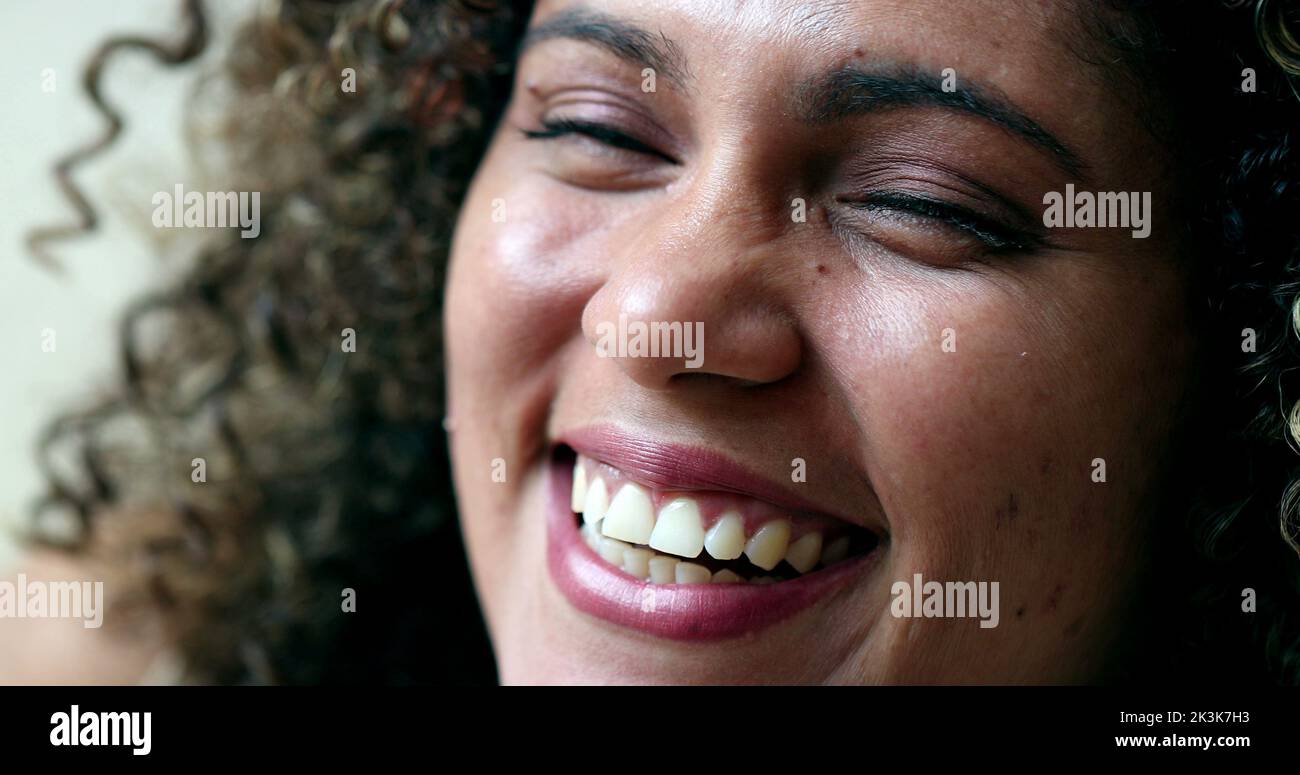 Hispanic black woman real life laugh and smile Stock Photo - Alamy