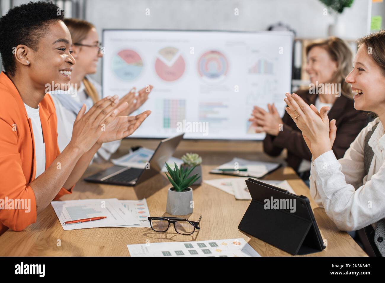 Two young women clapping their hands hi-res stock photography and ...