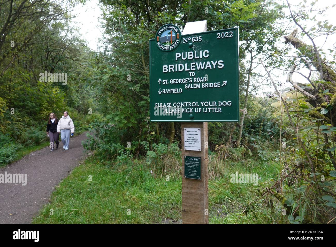 Two women walk along the Sett Valley Trail in New Mills, Derbyshire ...