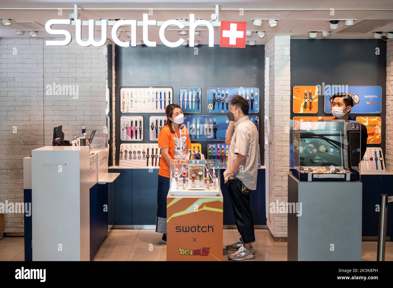 A client is seen at the Swiss multinational watchmaker Swatch brand ...