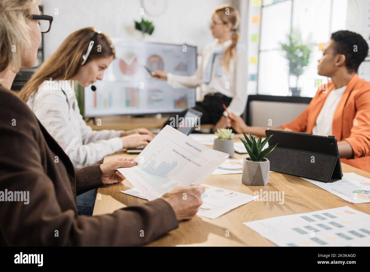 Blur background of multicultural female financiers discussing strategy ...