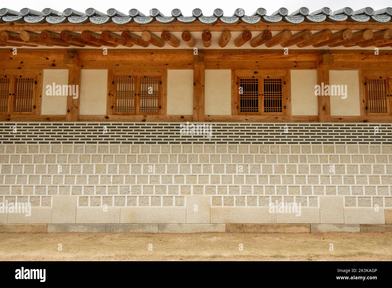 Traditional Korean stone wall boundary with roof Stock Photo - Alamy