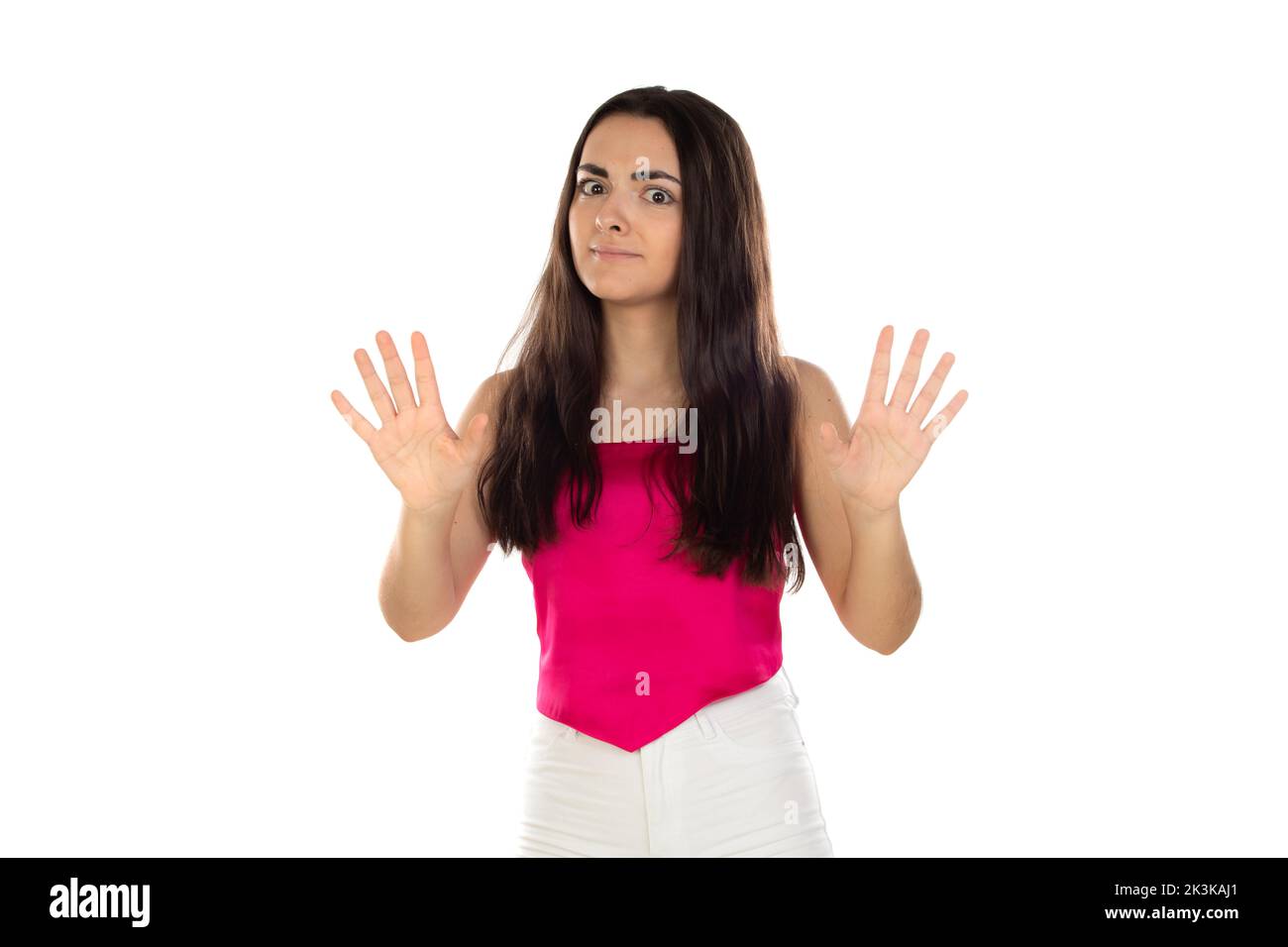 Surprised brunette girl with long hair refusing something isolated on a ...
