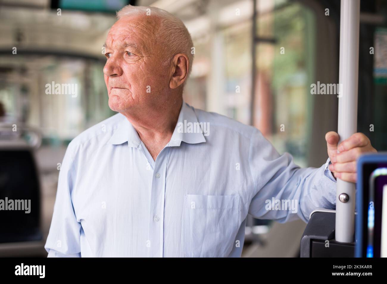 Senior European man in tram Stock Photo - Alamy