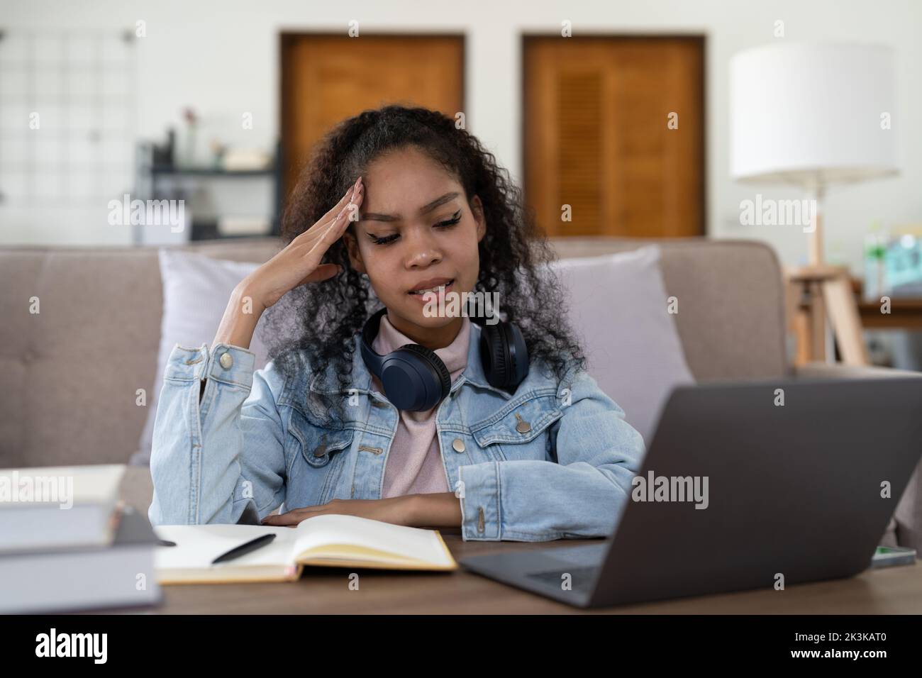 Exhausted african-american businesswoman having headache in office ...