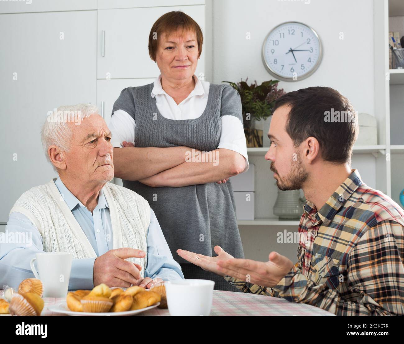 Parents arguing with son Stock Photo - Alamy