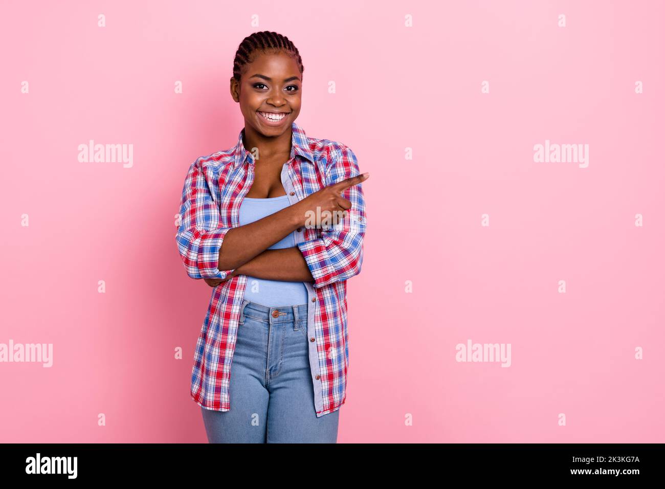 Photo of pretty cheerful lady indicate finger empty space blank ...