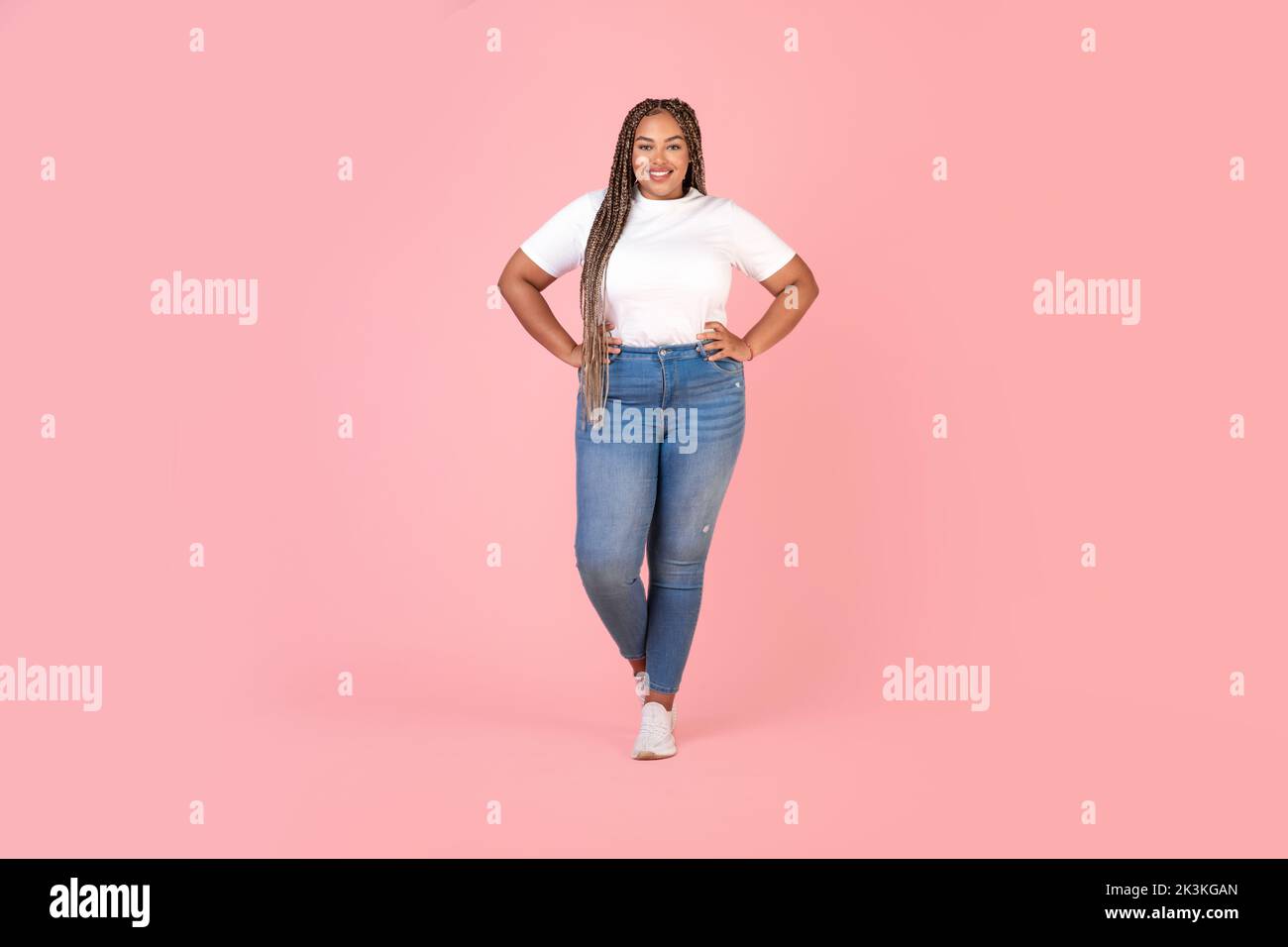 Happy African American Oversized Black Woman Standing Over Pink ...