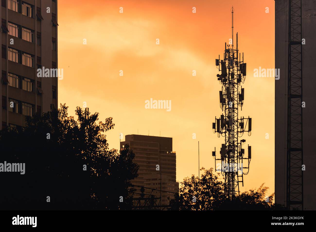 Communications Tower Between Buildings in the City Stock Photo - Alamy