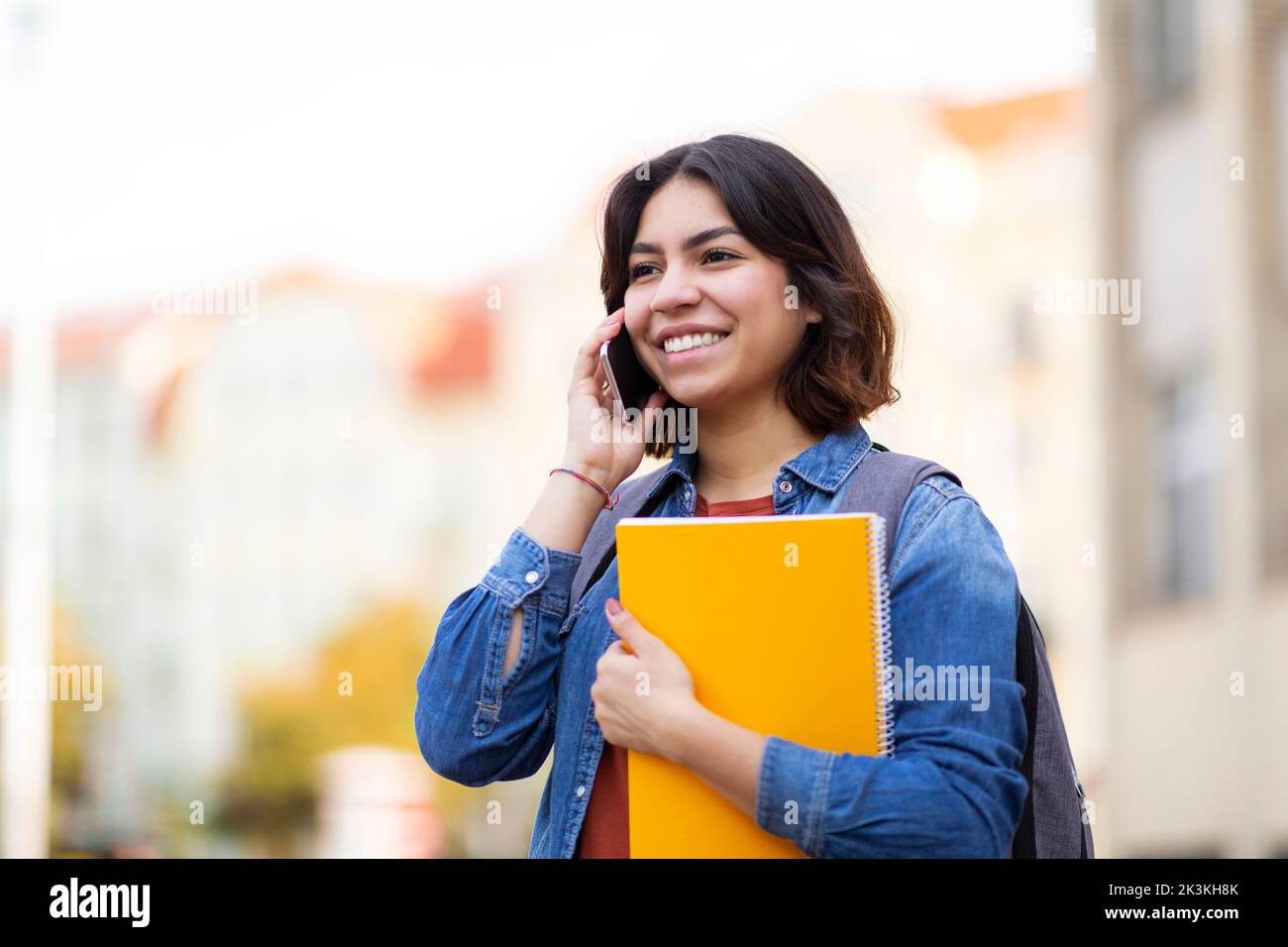 Happy Middle Eastern Student Female Talking On Cellphone While Walking ...