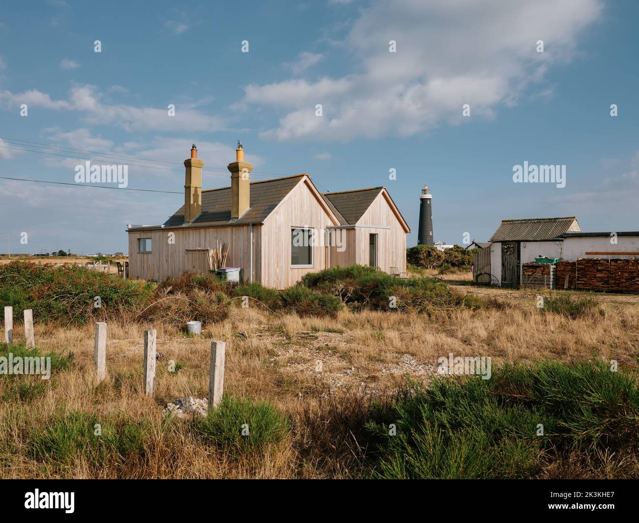 A recently renovated old house with new cladding in the flat coastal ...
