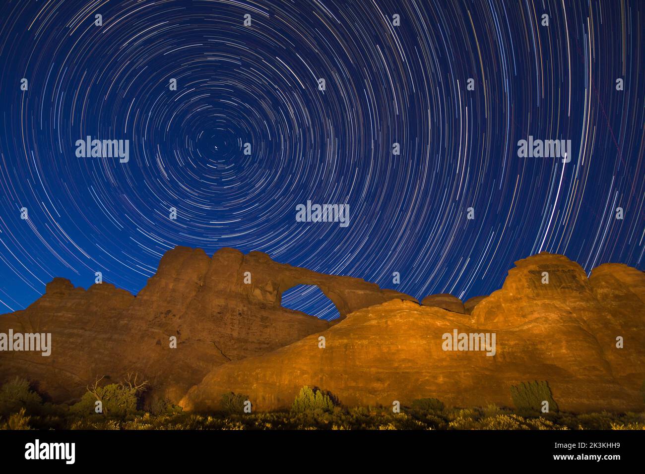 Star trails rotating around the North Star over Skyline Arch at night ...