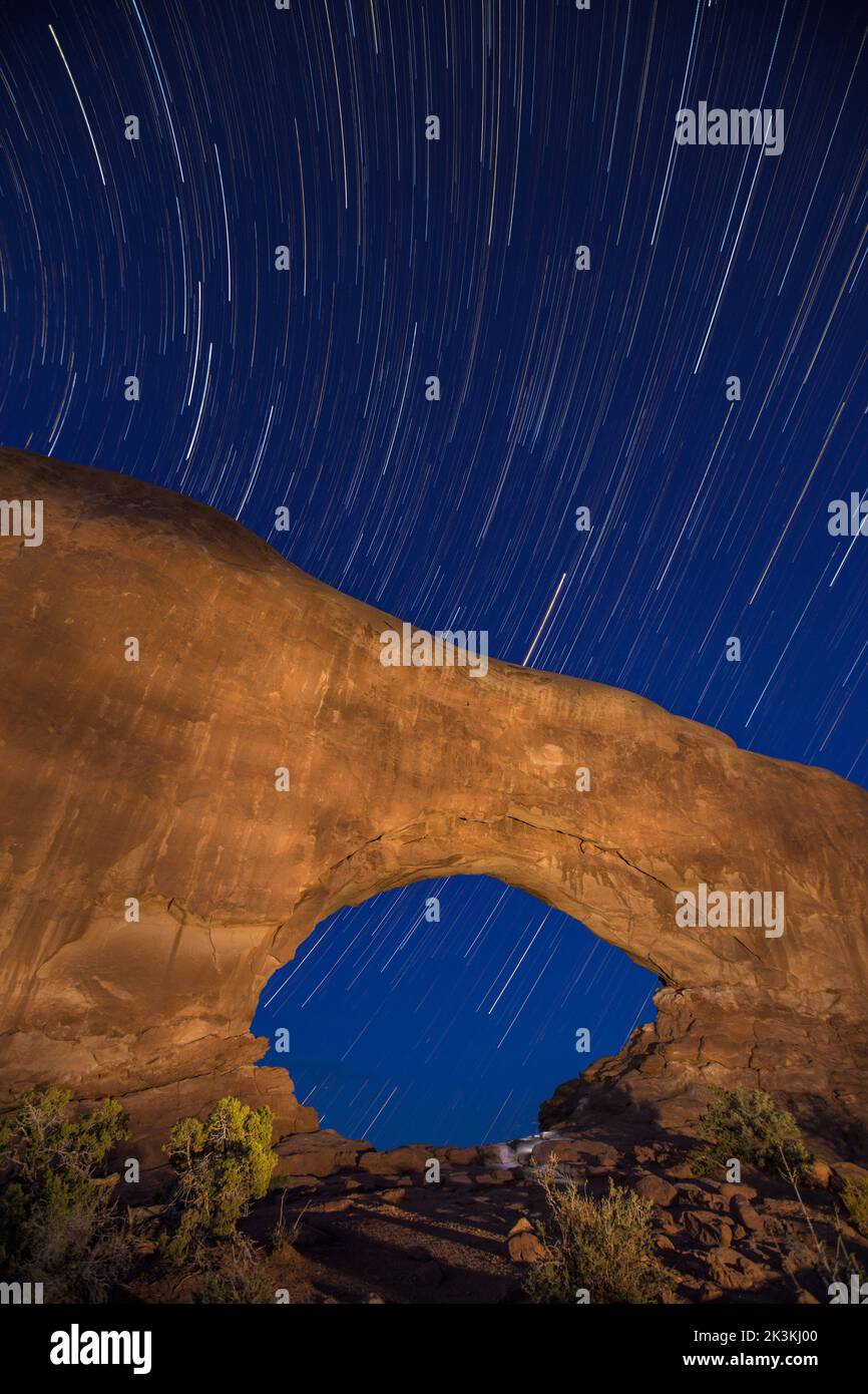 Star trails over the North Window at night with light painting in the ...