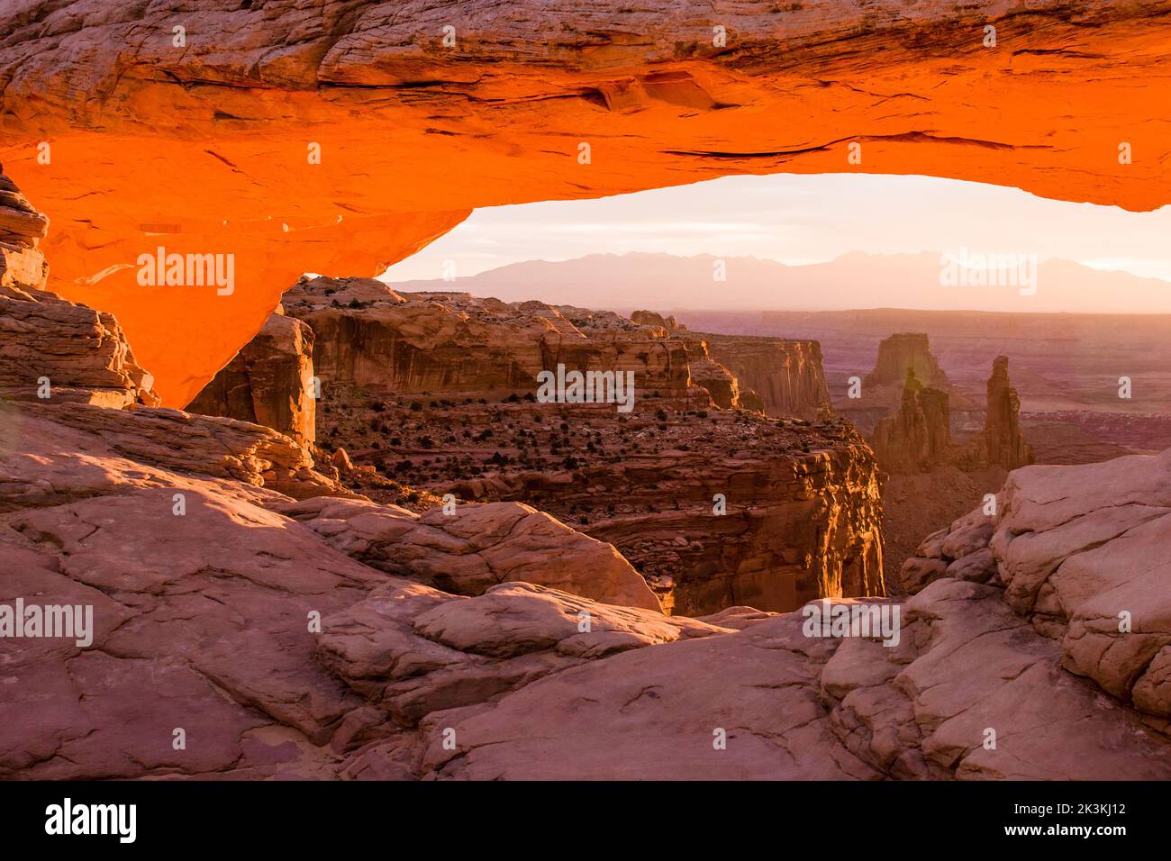 Mesa Arch at sunrise with the Washer Woman Arch, Monster Tower ...