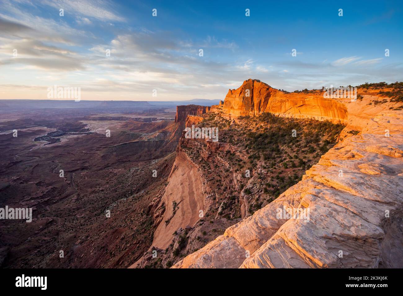 View of Buck Canyon and sandstone cliffs over the top of Mesa Arch at ...