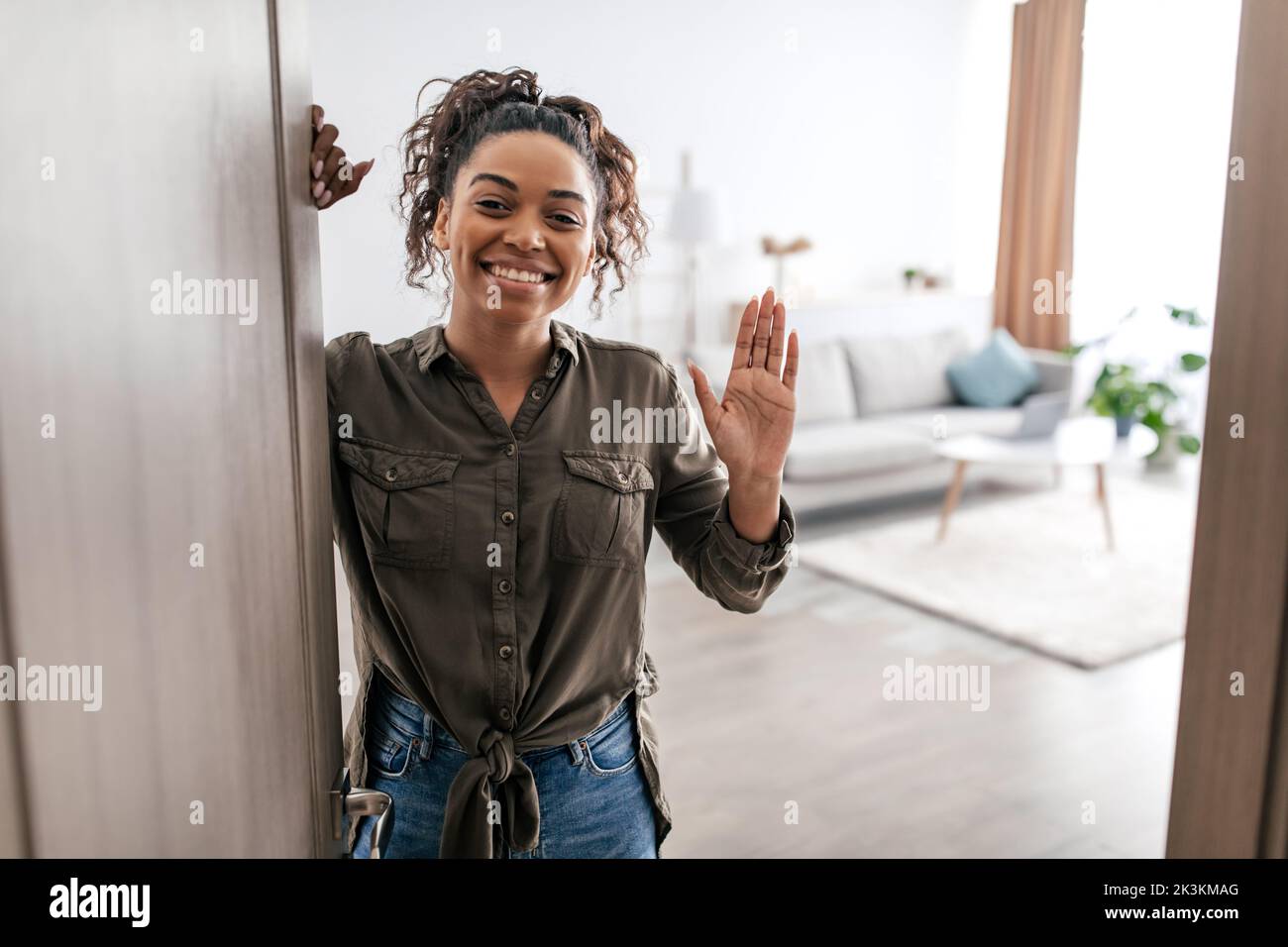 Black Woman Waving Hand Opening Door Meeting You At Home Stock Photo ...