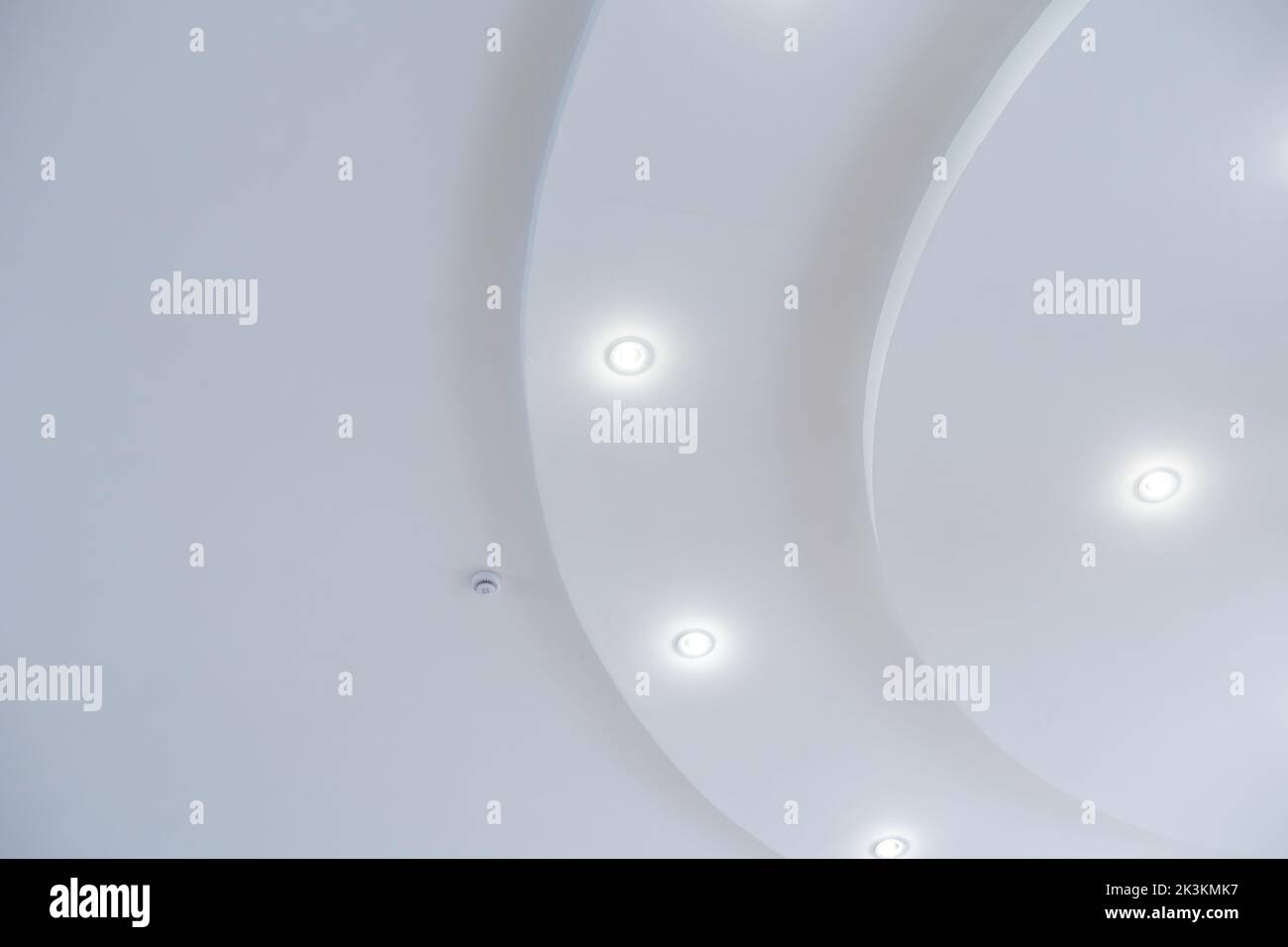 suspended ceiling with halogen spots lamps and drywall construction in ...