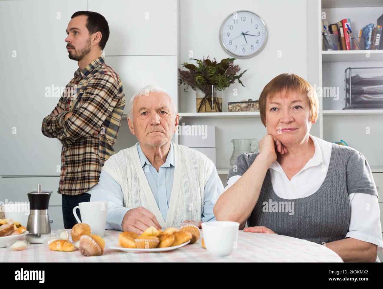 Parents arguing with son Stock Photo - Alamy