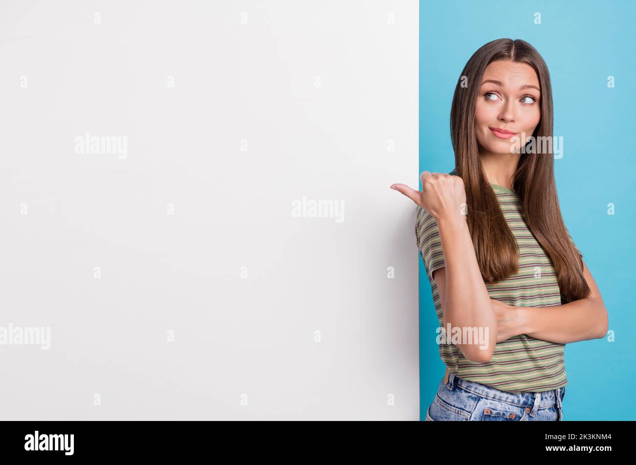Portrait of positive lovely girl with straight hair dressed striped t ...