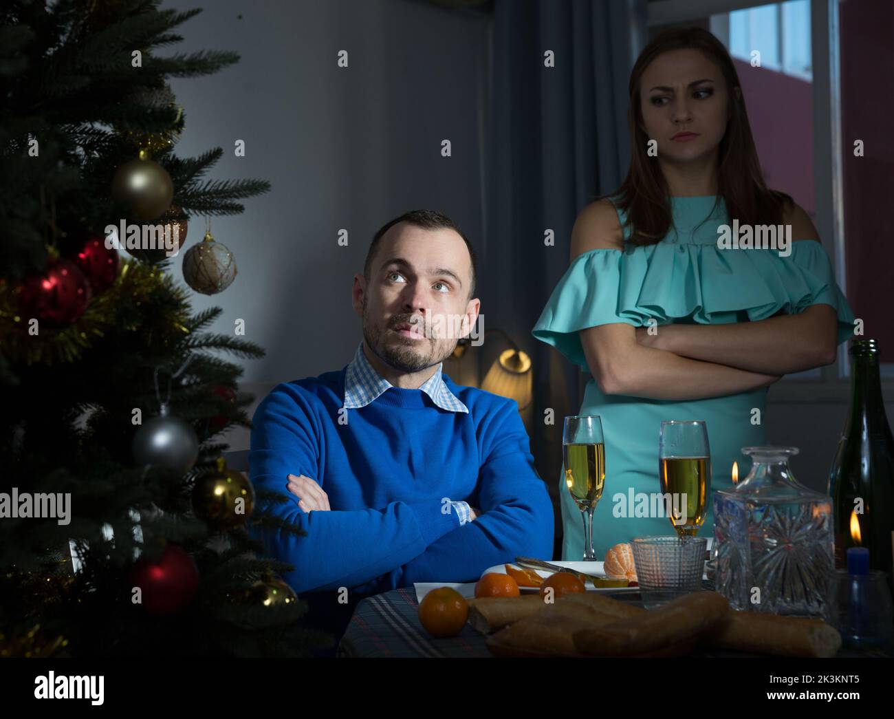 Couple after quarrel during celebration of Christmas Stock Photo - Alamy