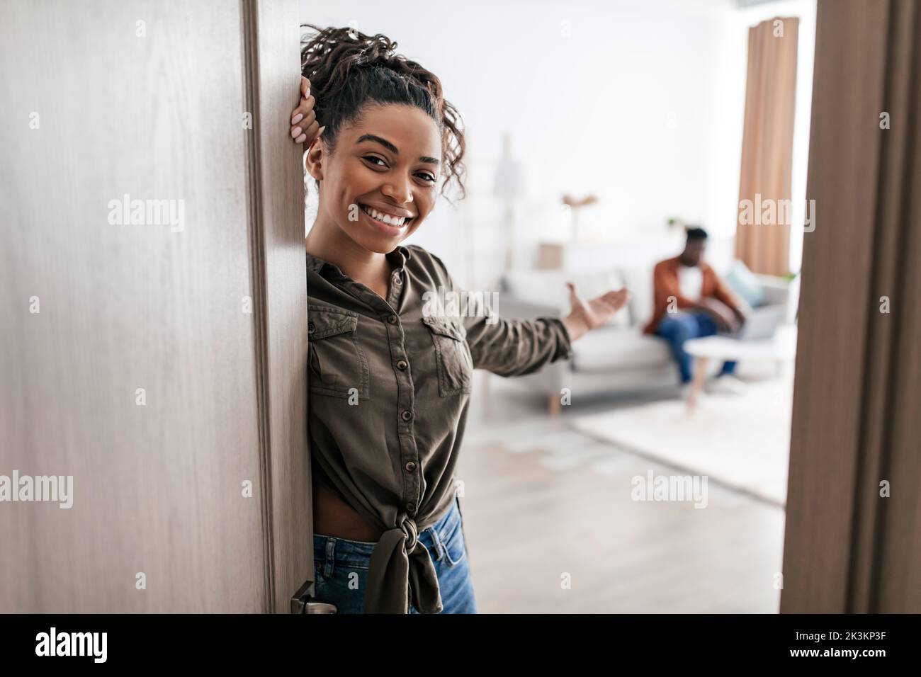 Happy African American Female Inviting You To House At Home Stock Photo ...