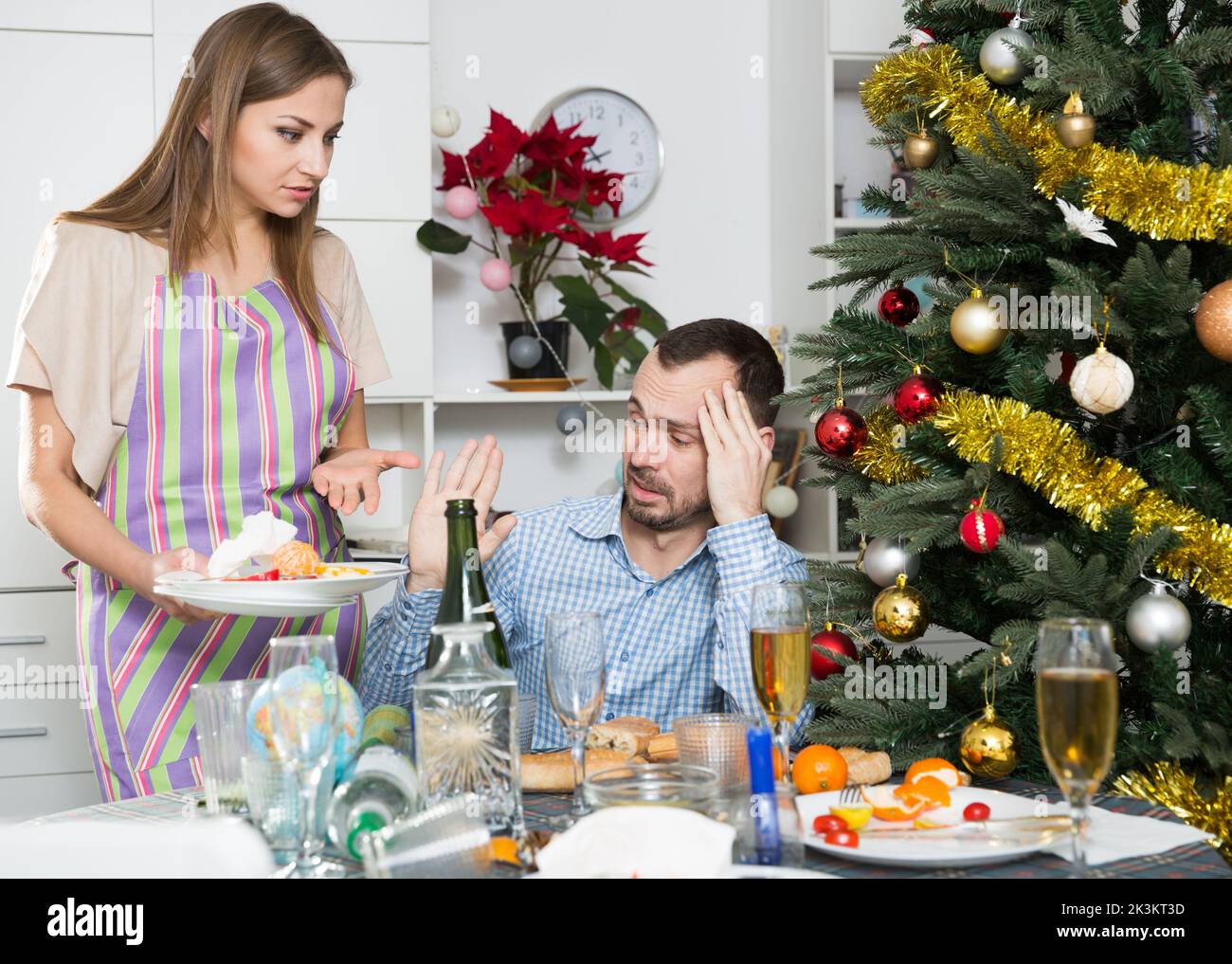 Woman cleaning table after dinner Stock Photo - Alamy