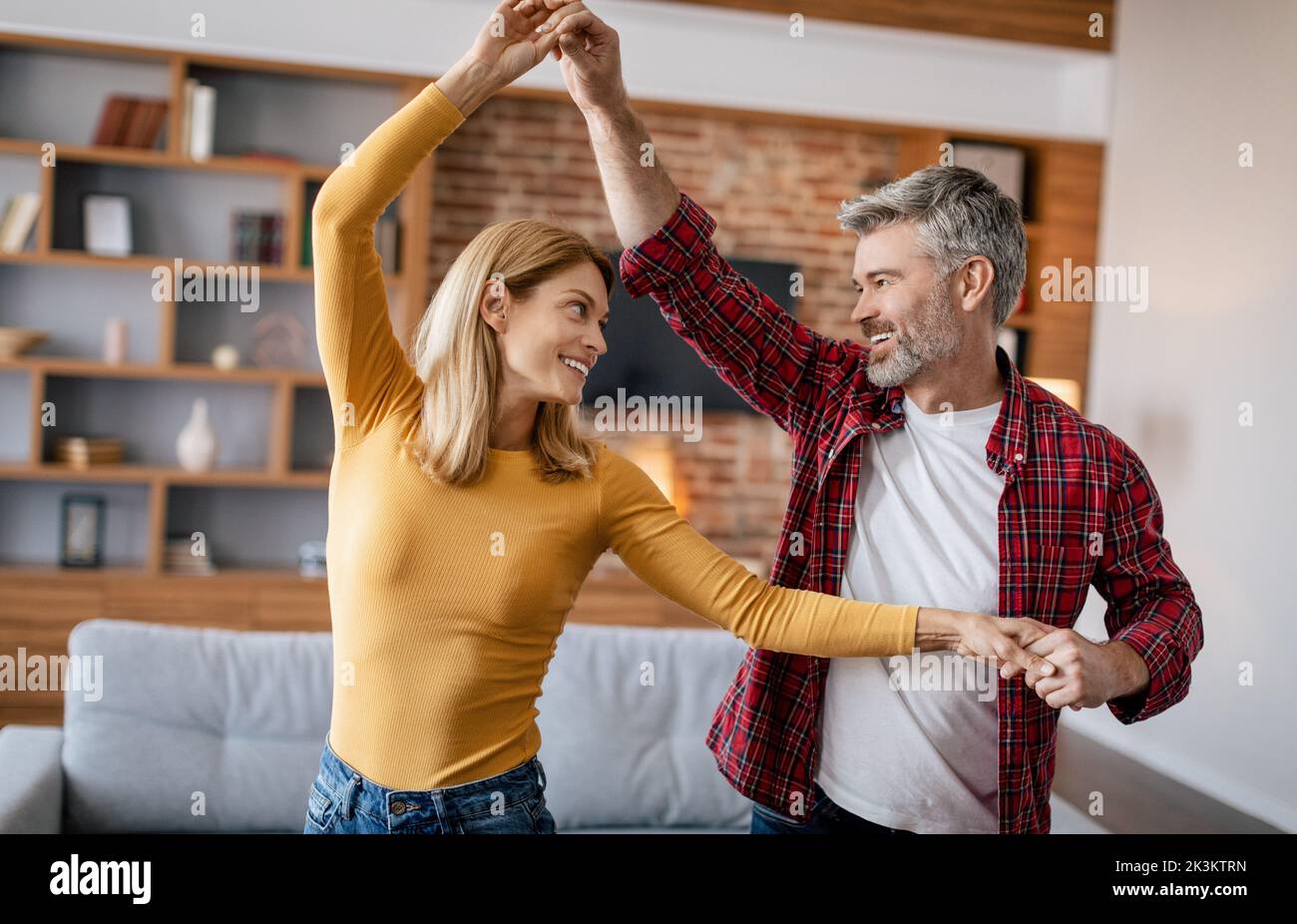 Cheerful mature european female and male relaxing, enjoy free time ...