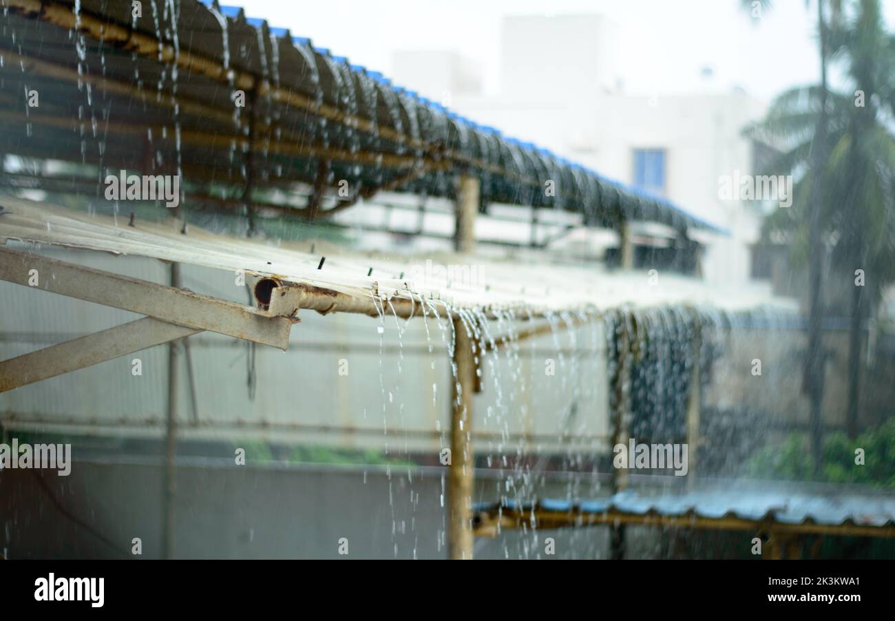Rain on a Tin Roof. Rain Falling from the Roof. Rainy day nature ...