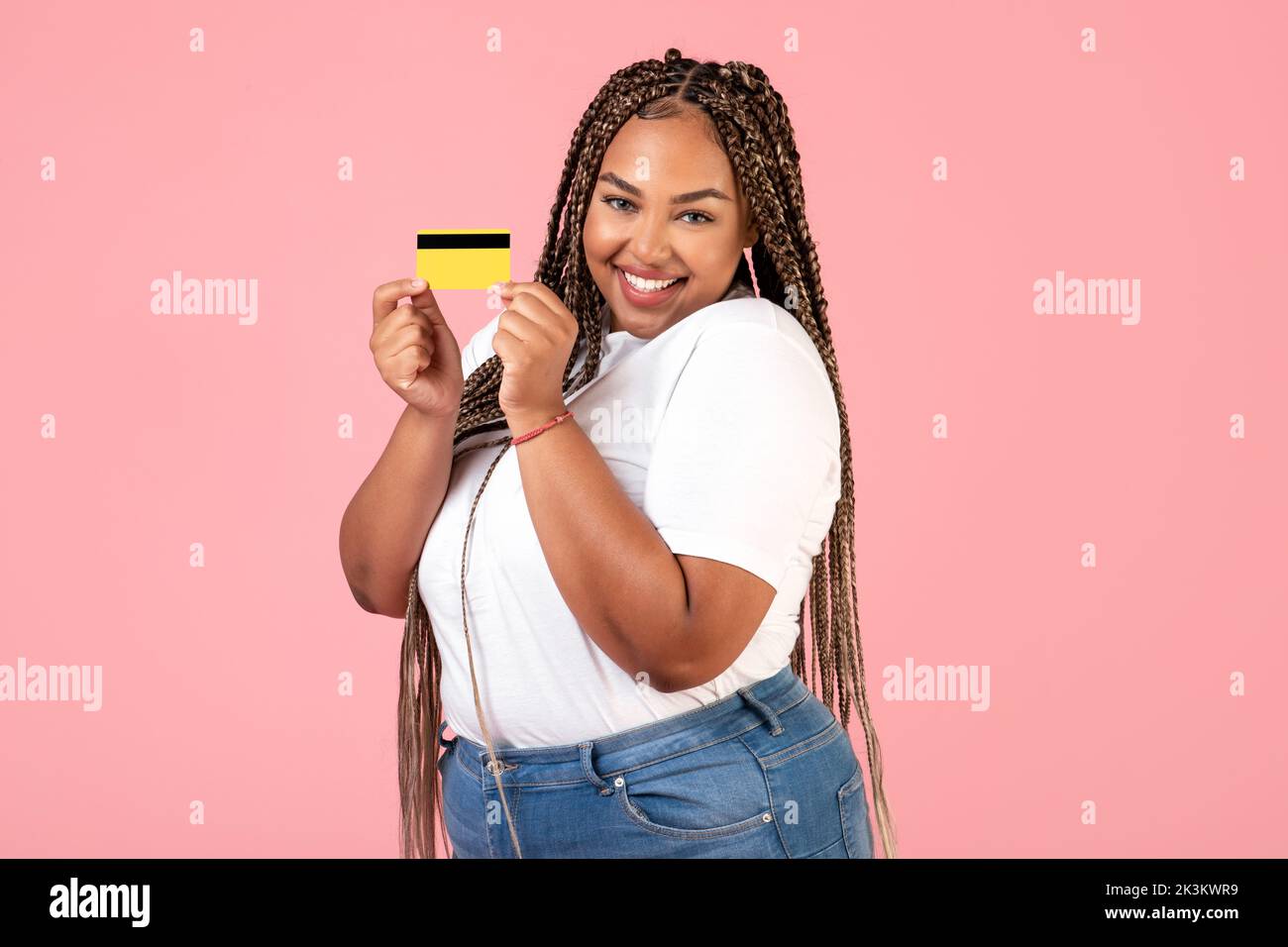 Cheerful Black Lady Showing Credit Card Standing Over Pink Background ...