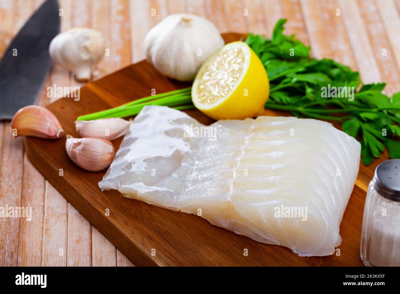 Raw pink cusk-eel fish fillet, seafood ingredients Stock Photo - Alamy