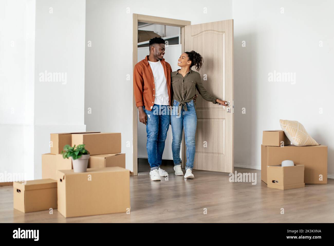 Black Couple Entering New Home Together, Hugging Moving House Stock ...