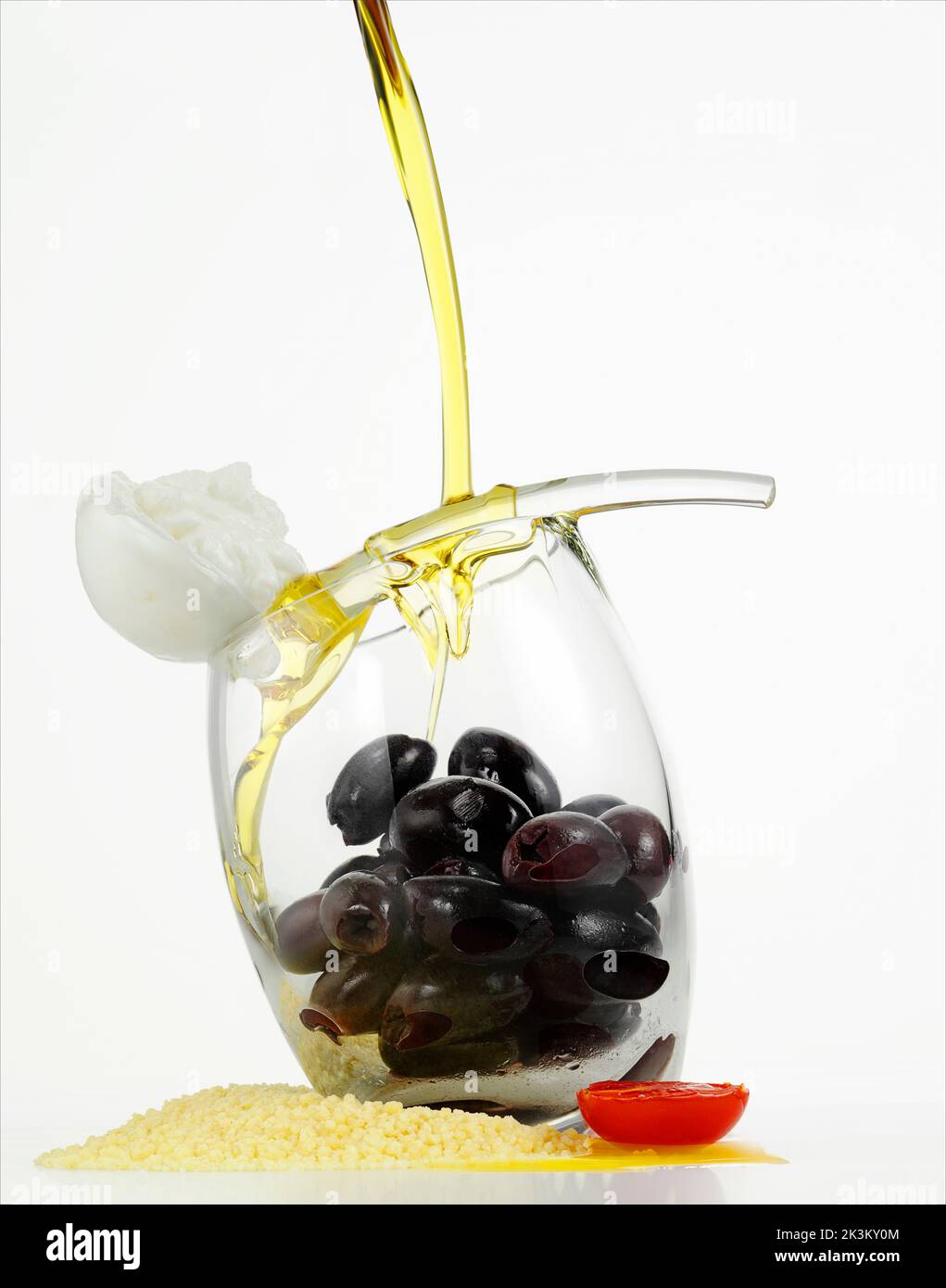 Oil pouring over olives Stock Photo - Alamy
