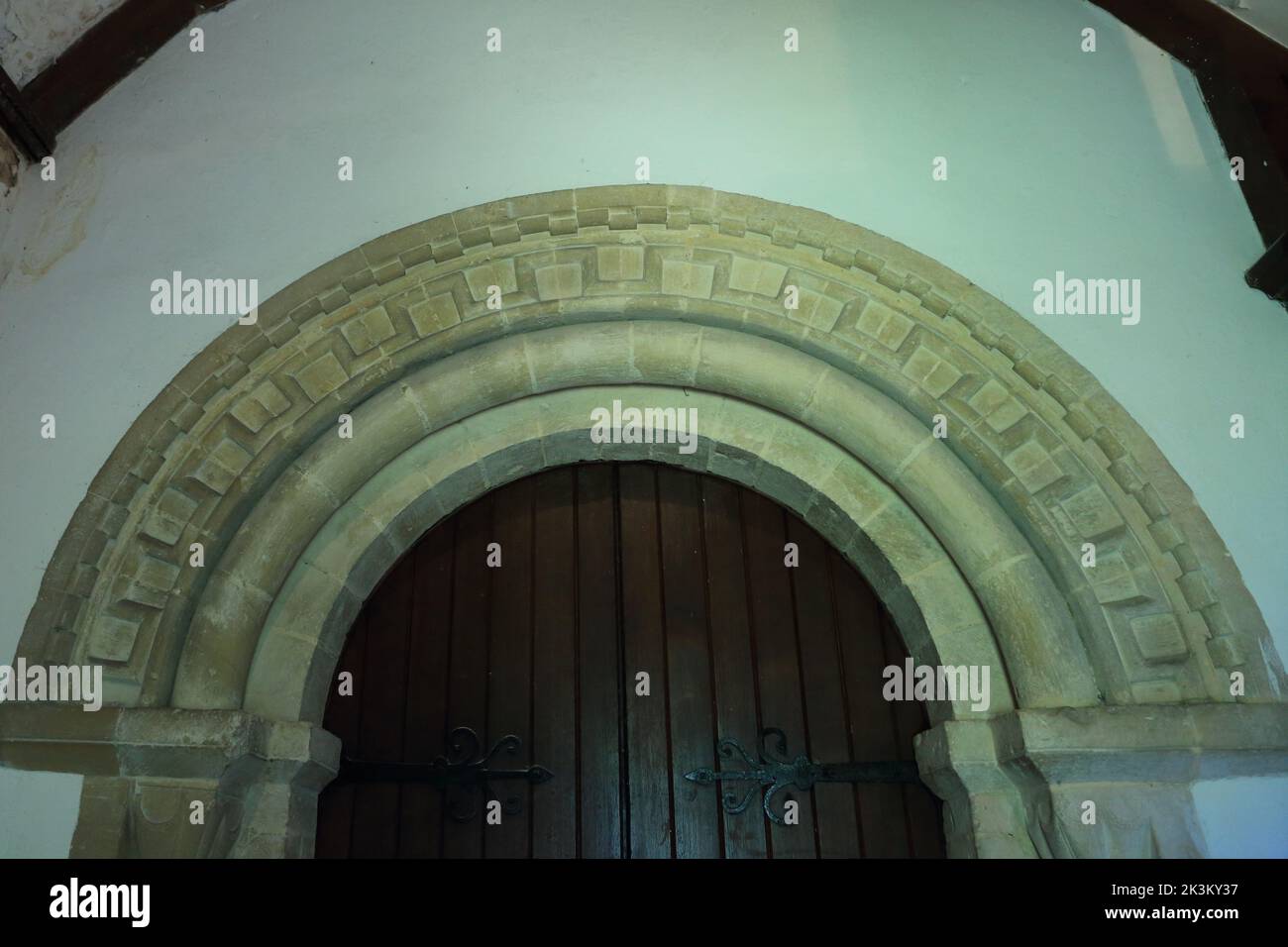 Norman arch over doorway into the church of Saint Peter and Saint Paul ...