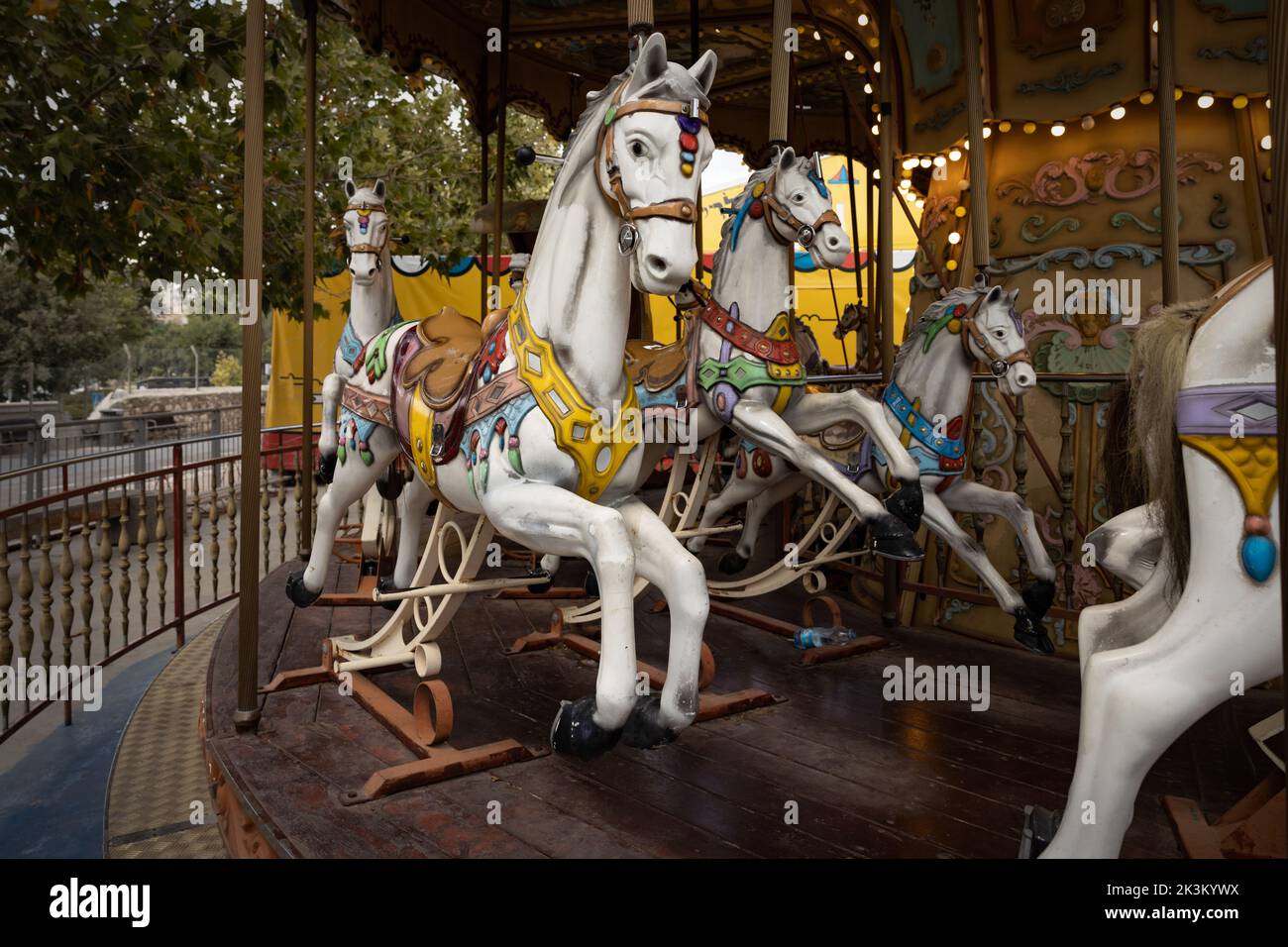 Vintage carousel horses in an amusement park Stock Photo - Alamy