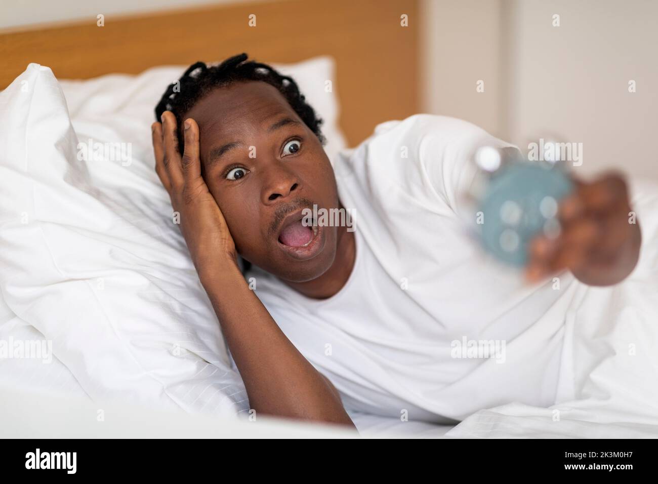Looking at alarm clock hi-res stock photography and images - Alamy