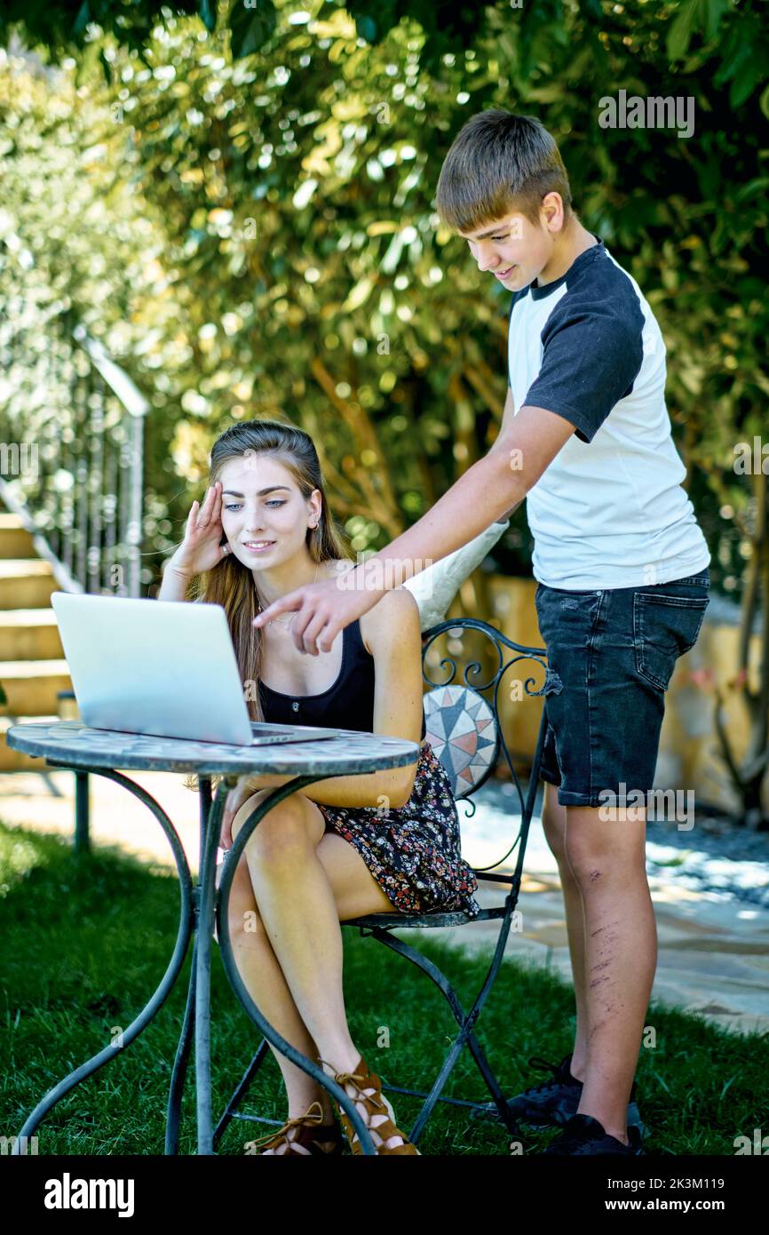 Brother sister laptop computer models hi-res stock photography and ...