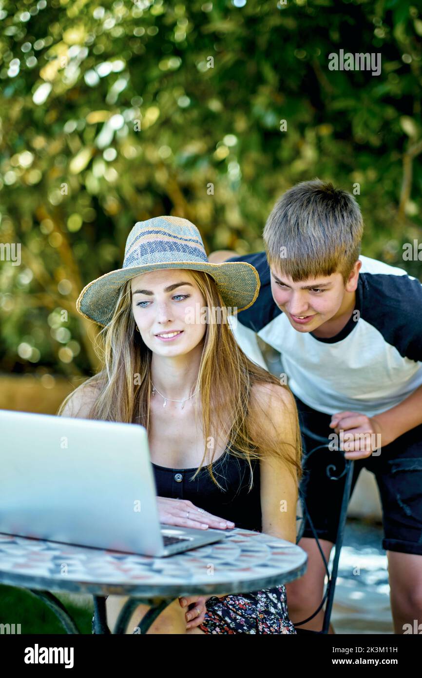 Brother sister laptop computer models hi-res stock photography and ...