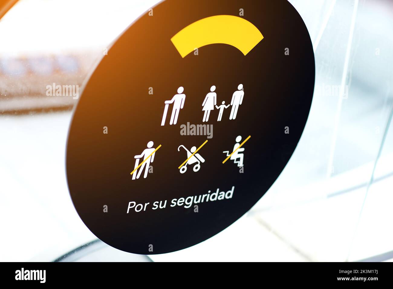 warning signs on an escalator at the shopping mall in Spain, safety ...