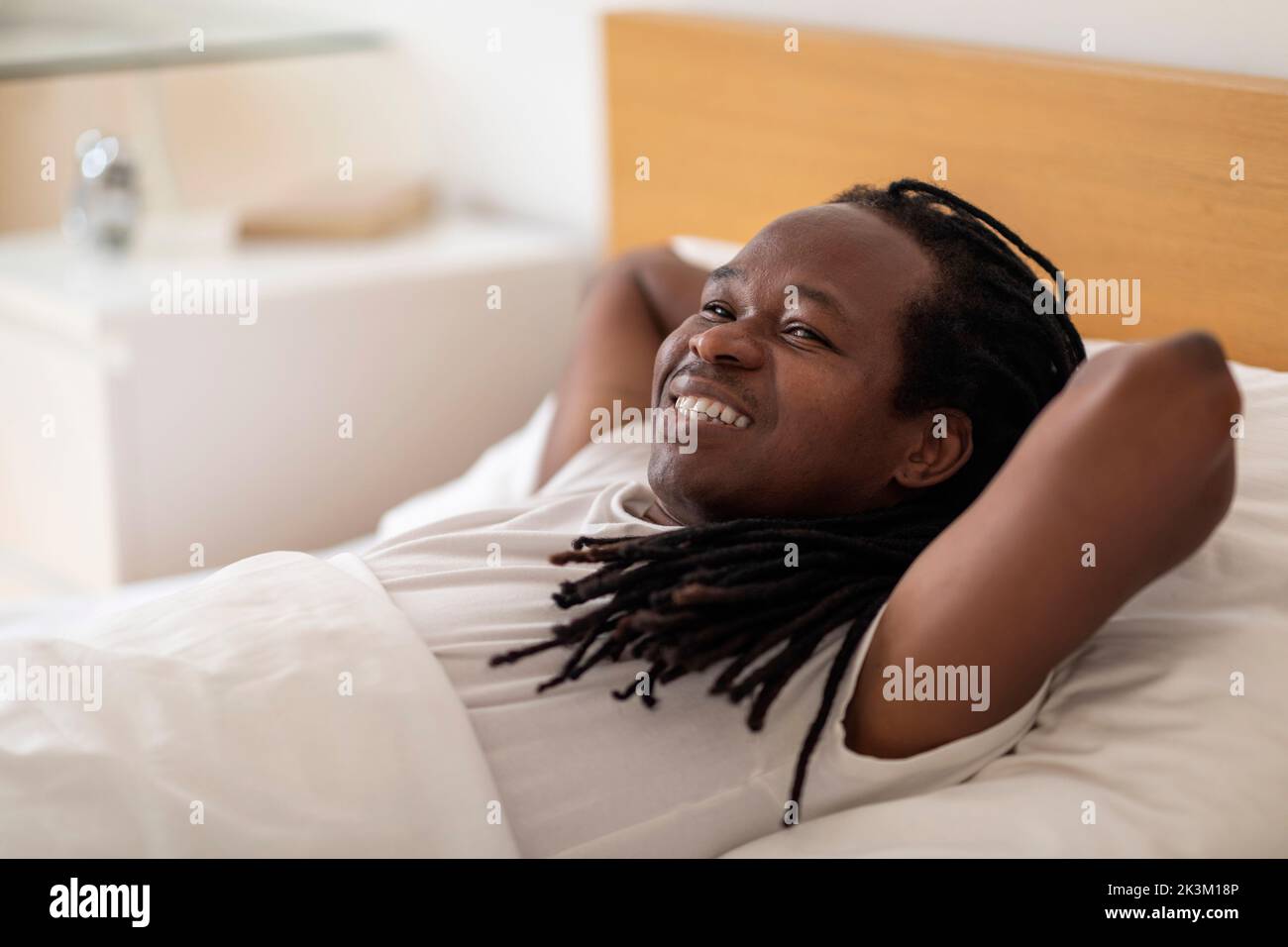 Good Morning. Happy Young Black Man Pleased Waking Up In Comfortable ...