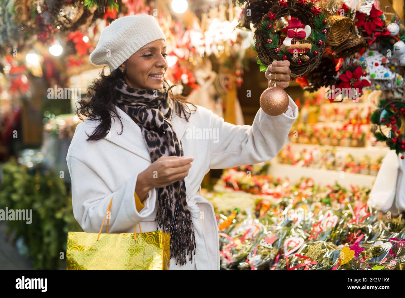 Latin American woman chooses Christmas souvenirs and toys Stock Photo ...