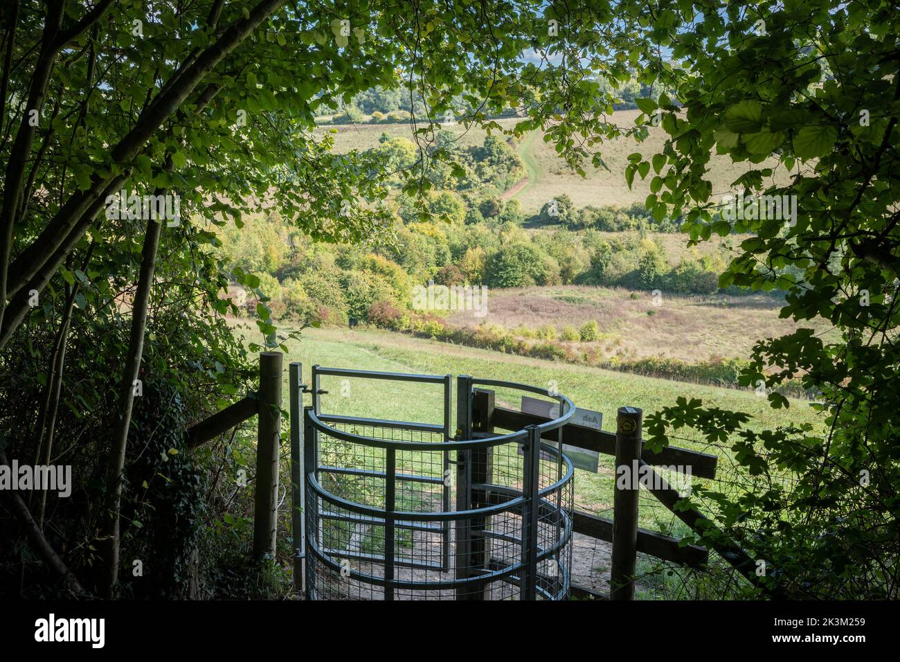 Walkers passing through kissing gate hi-res stock photography and ...