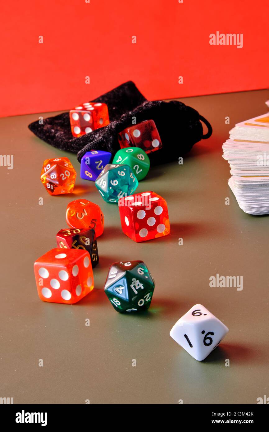 Game of dice to play role-playing of different colors on a table Stock ...