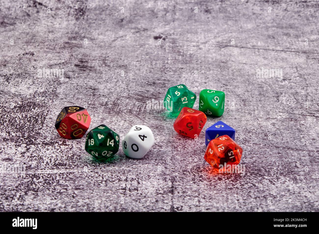 Different colored dice on an abstract cement-like background Stock ...