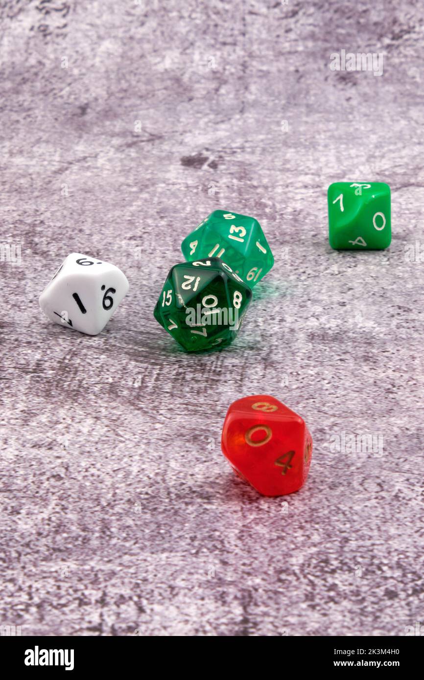 Different colored dice on an abstract cement-like background Stock ...