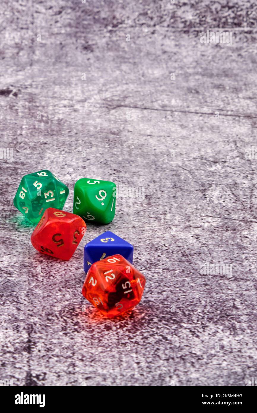 Different colored dice on an abstract cement-like background Stock ...