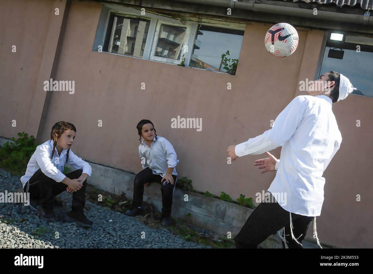 Young Ultra-Orthodox Jewish pilgrims play ball during the celebration ...