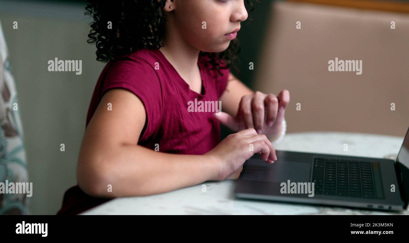 Little girl kid using laptop. Child browsing internet on computer Stock ...