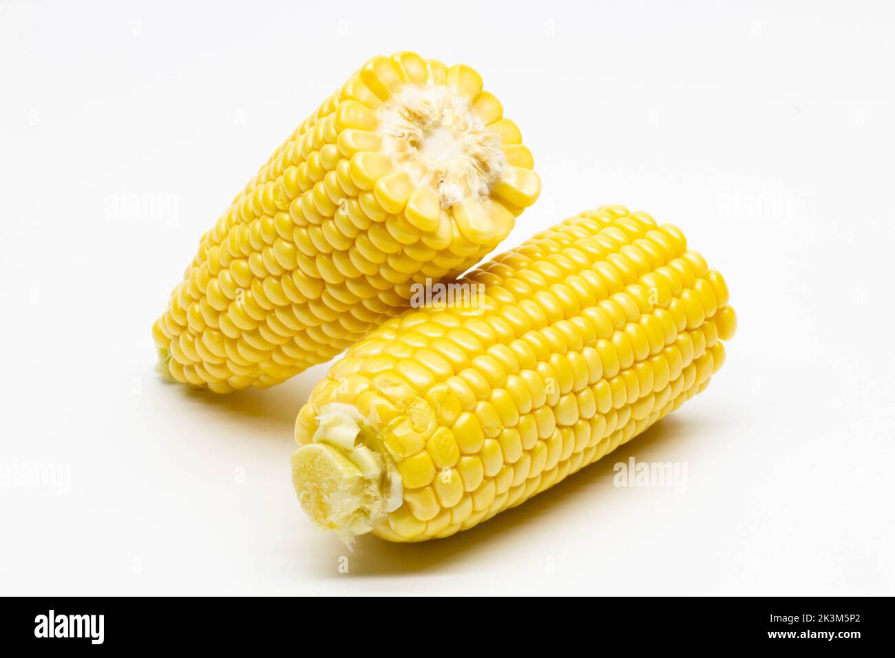 Two halves ear of ripe sweet corn isolated on white background ...